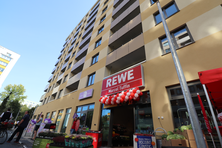 Wohnen auf dem Supermarkt | REWE Presse